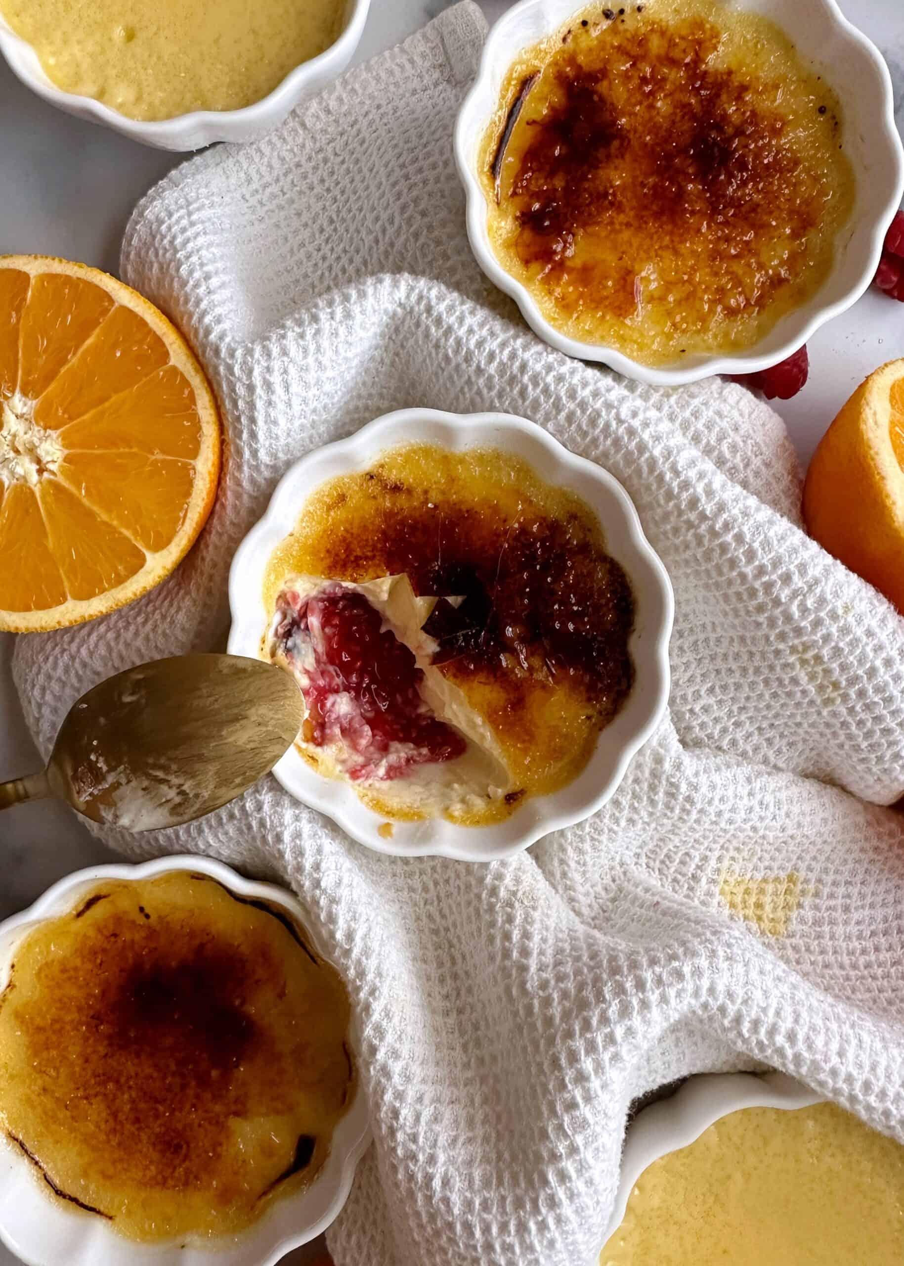 Orange Vanilla Creme Brulee with Raspberry Coulis - Laura Loves to Cook